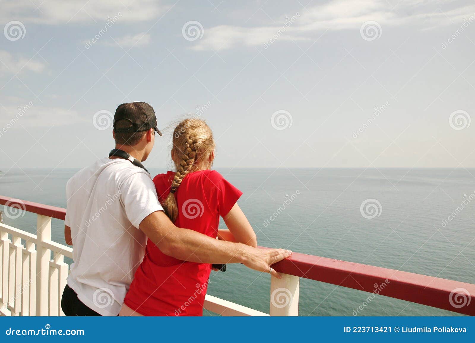 Young People Look from the Bridge into the Distance at the Sea Stock ...