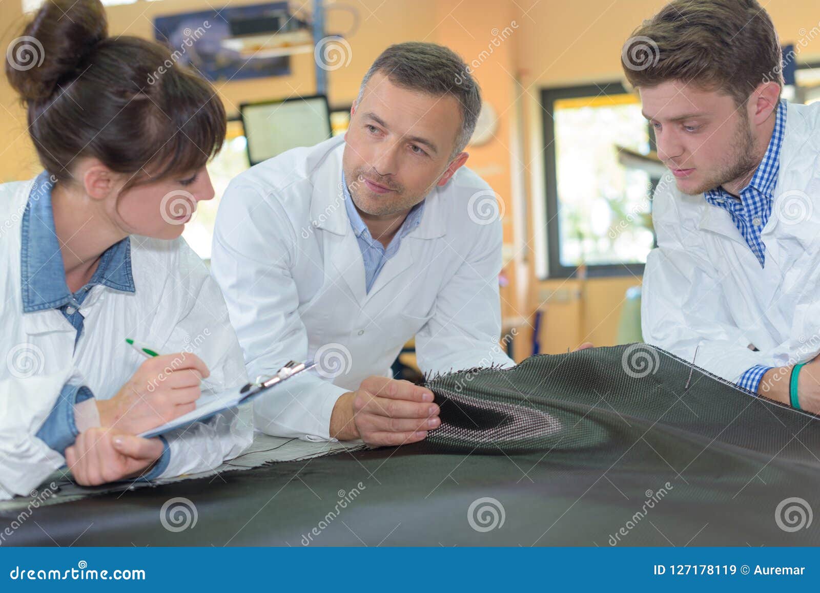 Young People Looking at Material Taking Notes on Clipboard Stock Image ...
