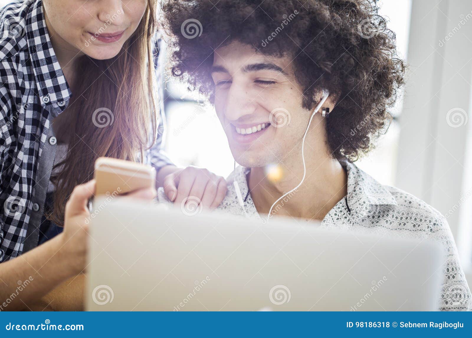 Young People Looking at Phone Stock Photo - Image of conversation ...