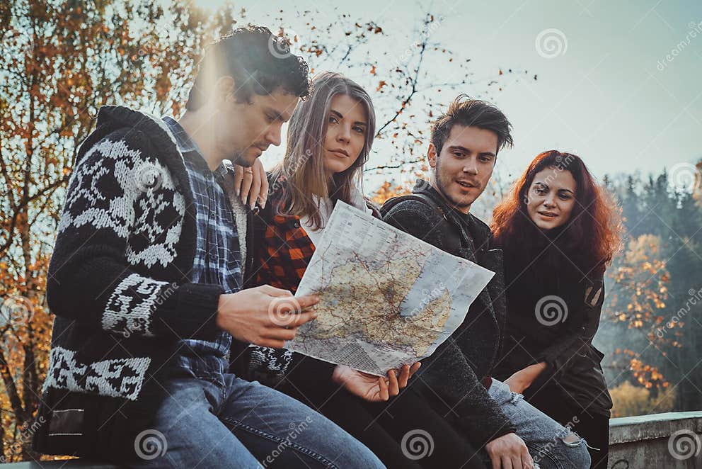 Young People are Looking for Right Path Using Map Stock Image - Image ...