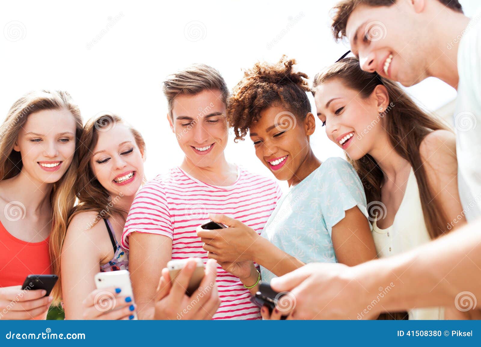 Young People Looking At Smartphones Stock Photo - Image: 41508380