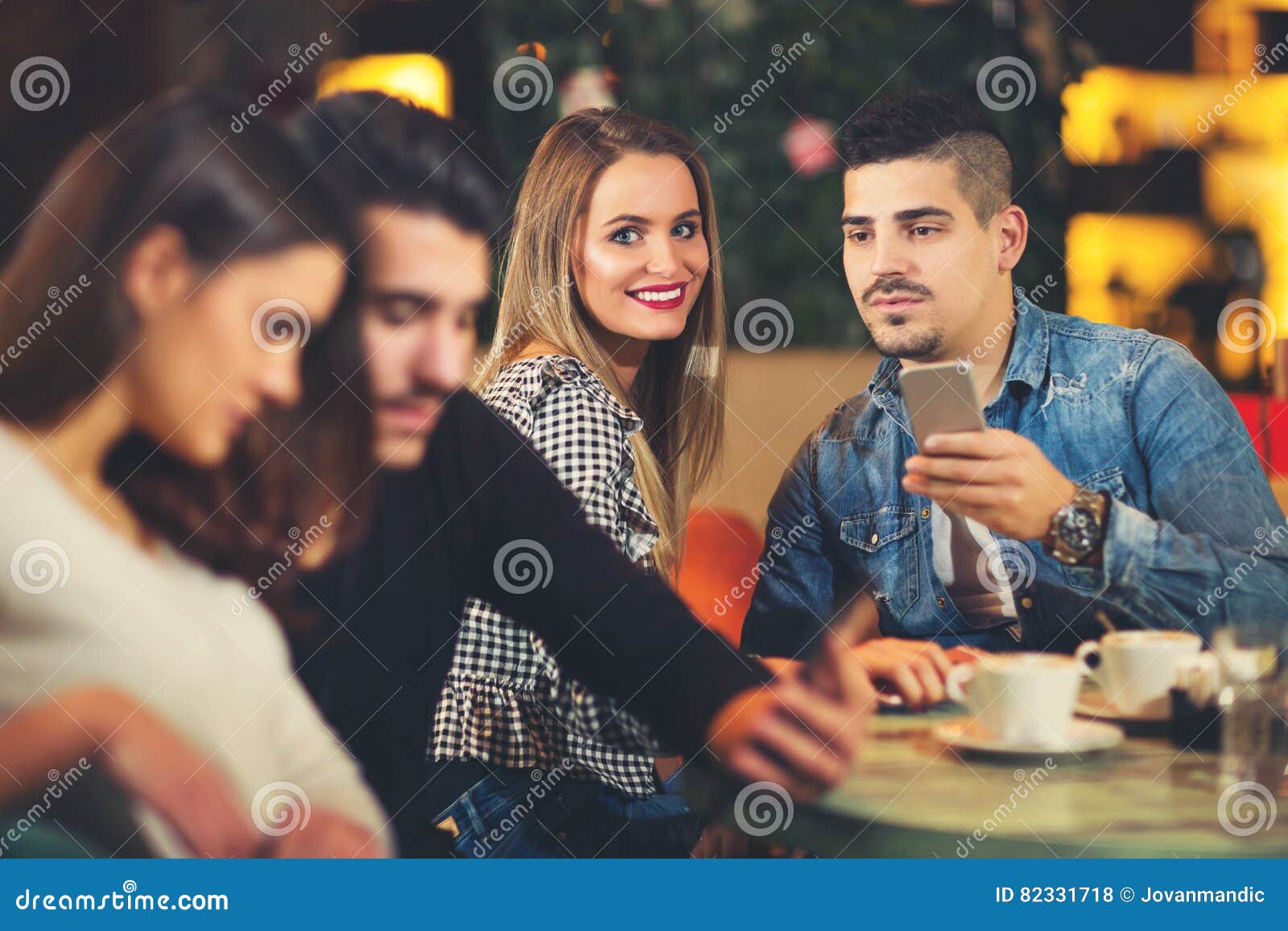 Young People Meeting in a Cafe. Stock Photo - Image of restaurant ...