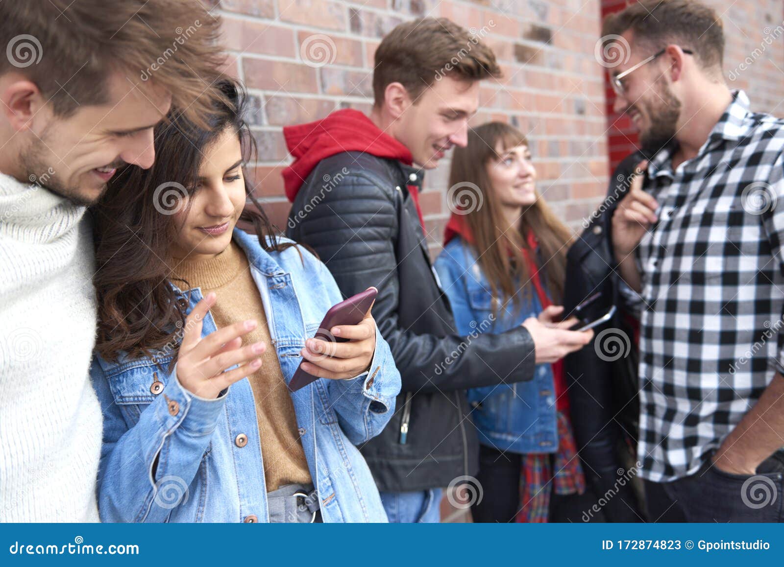 Young People with Mobile Phone Spending Time Together Stock Image ...