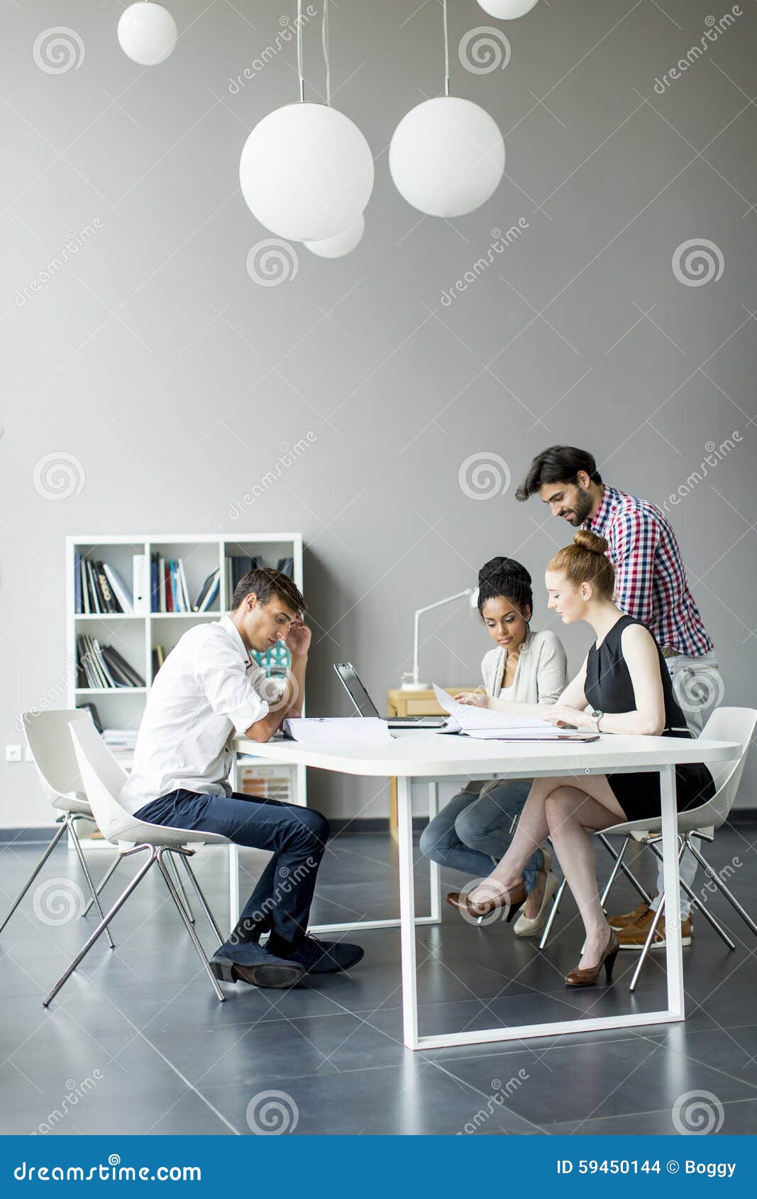 Young people in the office stock photo. Image of confident - 59450144
