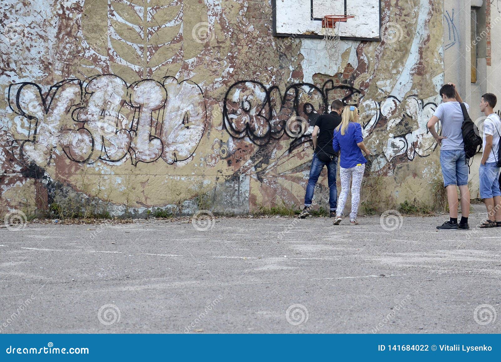 Young Street Artists Paint Graffiti on the Wall Editorial Photography ...