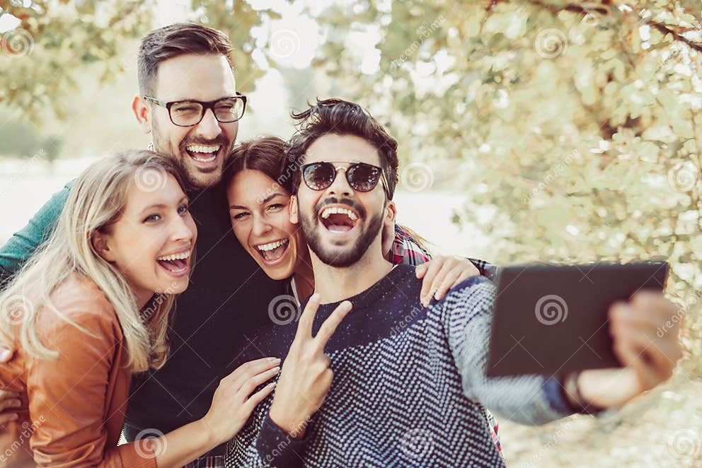 Young People in Park with Digital Tablet Having Fun Stock Image - Image ...