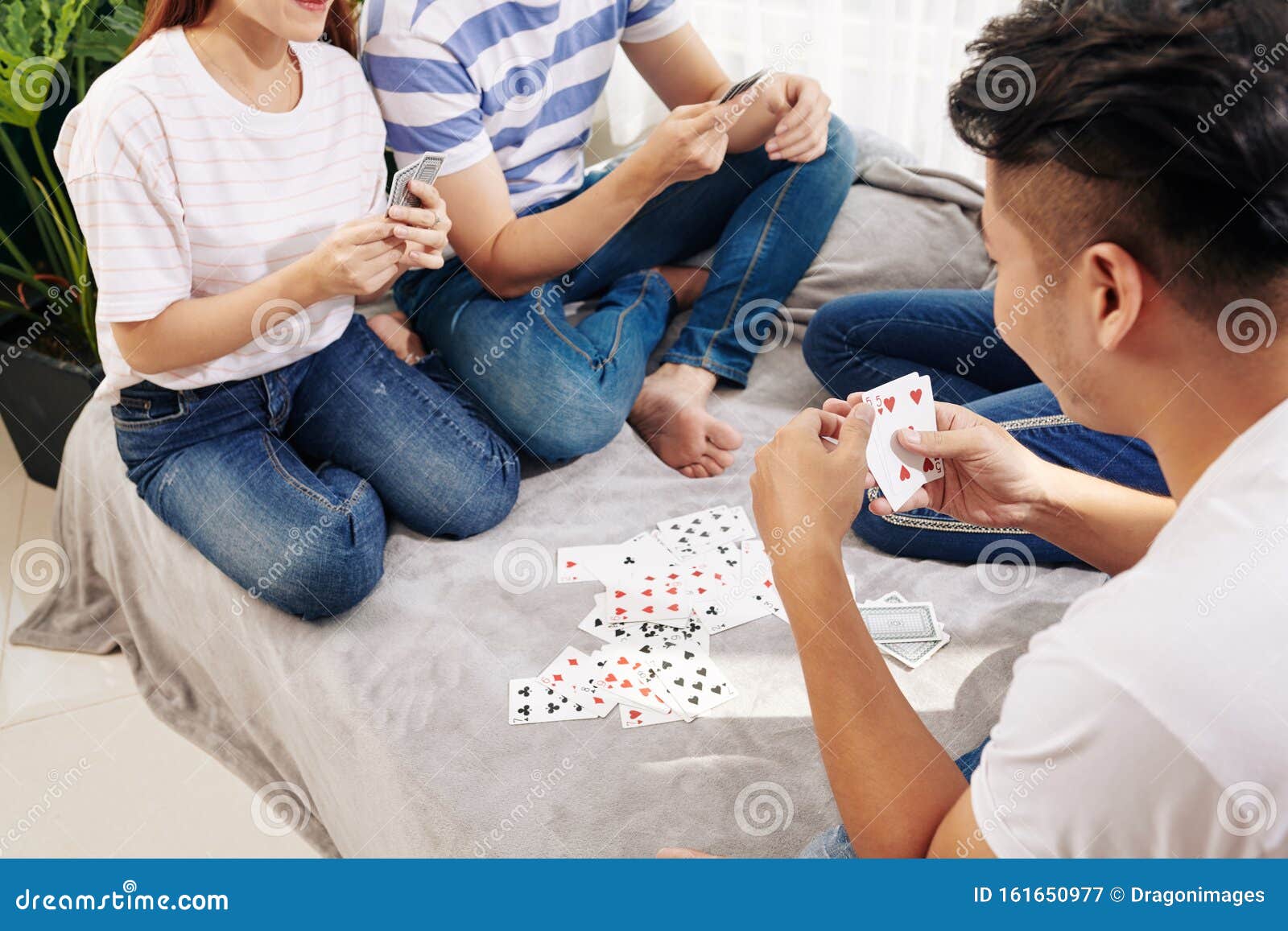 Young People Playing Card Game Stock Image - Image of cheerful, playful ...