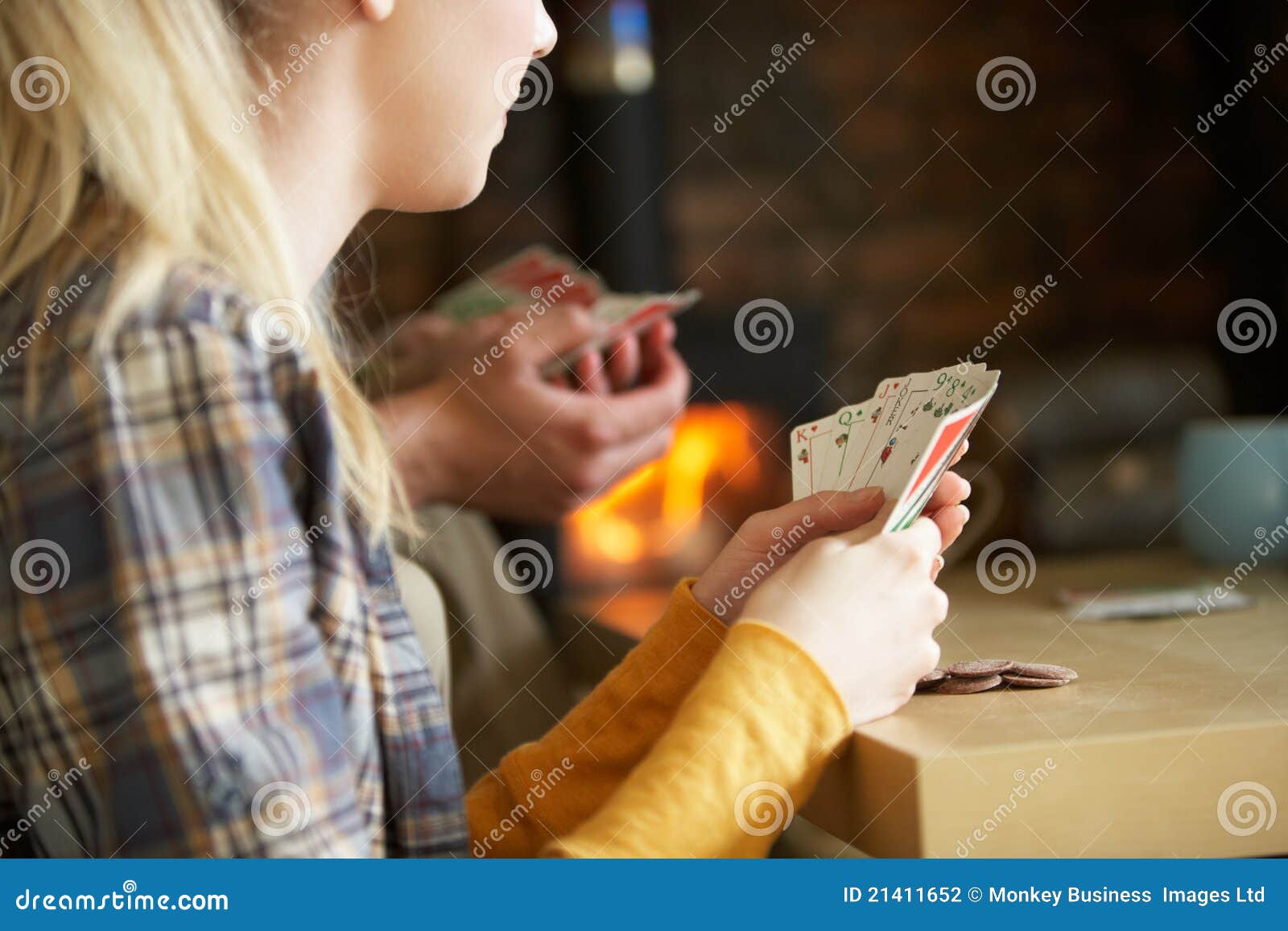 Young people playing cards stock photo. Image of hand - 21411652