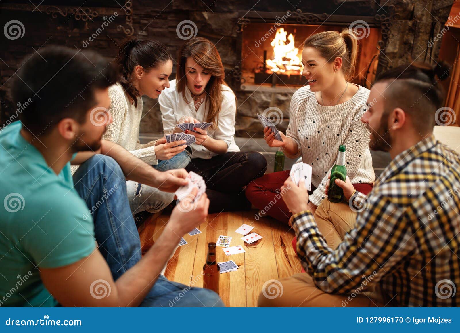 Young People Playing Cards on Winter Holiday Stock Photo - Image of ...