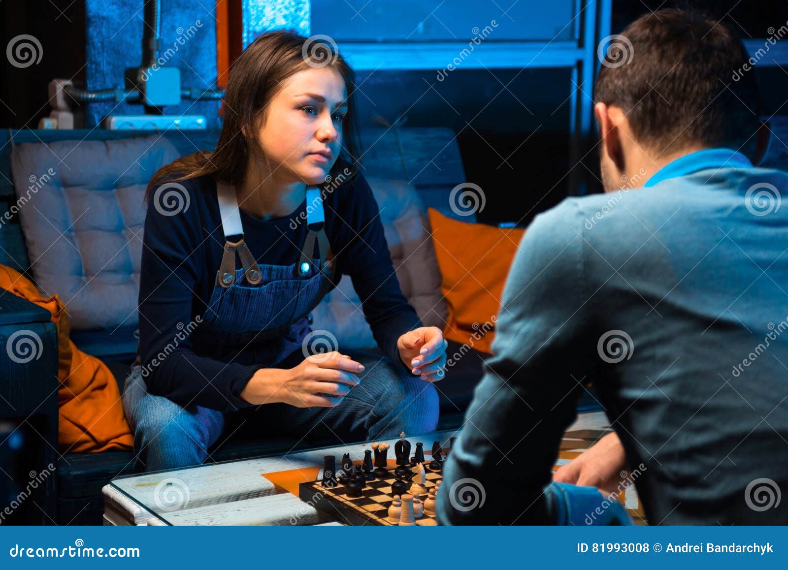 Young people playing chess stock photo. Image of hand - 81993008