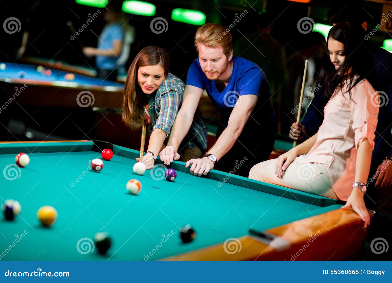 Young people playing pool stock image. Image of people - 55360665