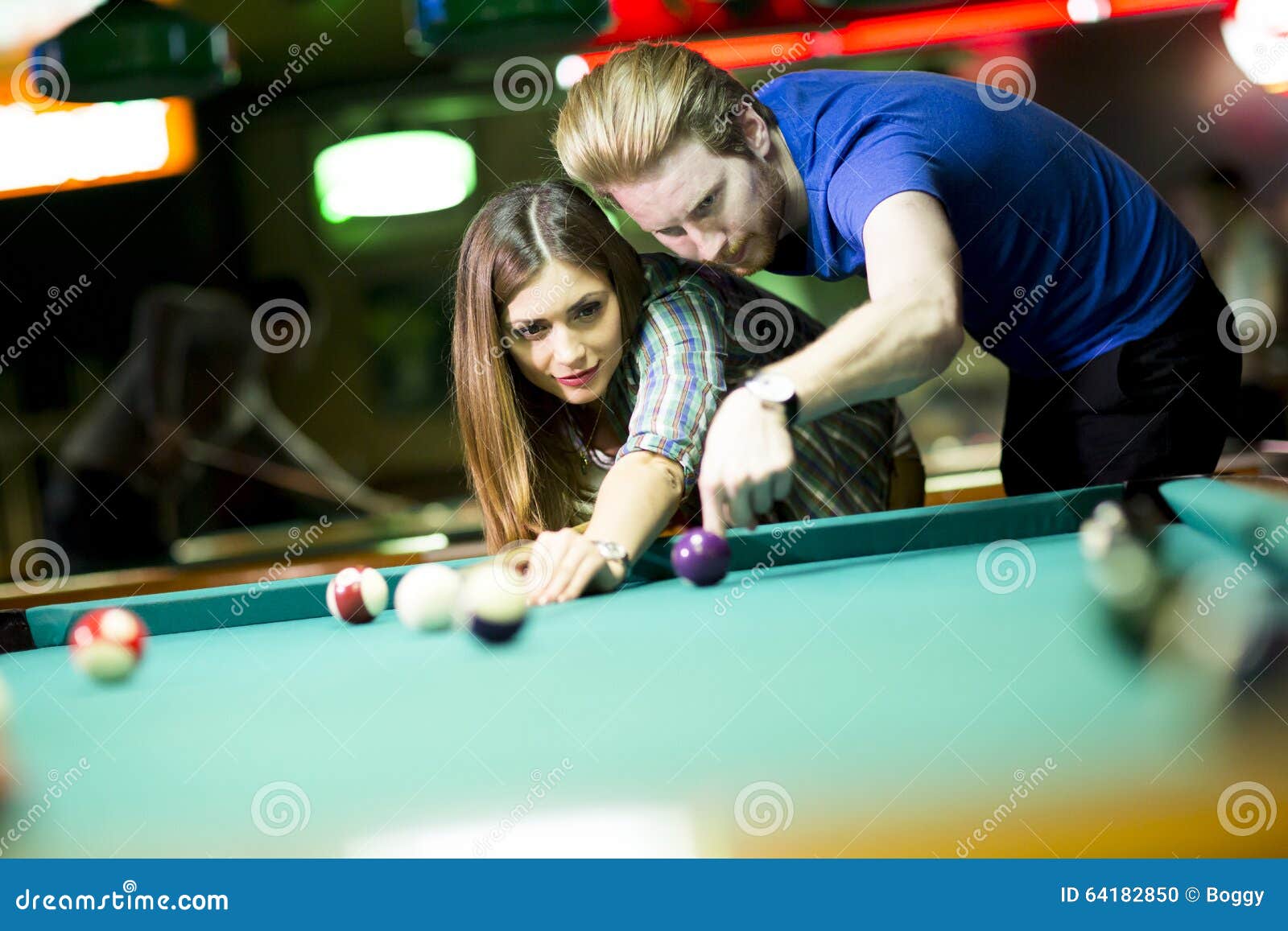 Young people playing pool stock photo. Image of beautiful - 64182850