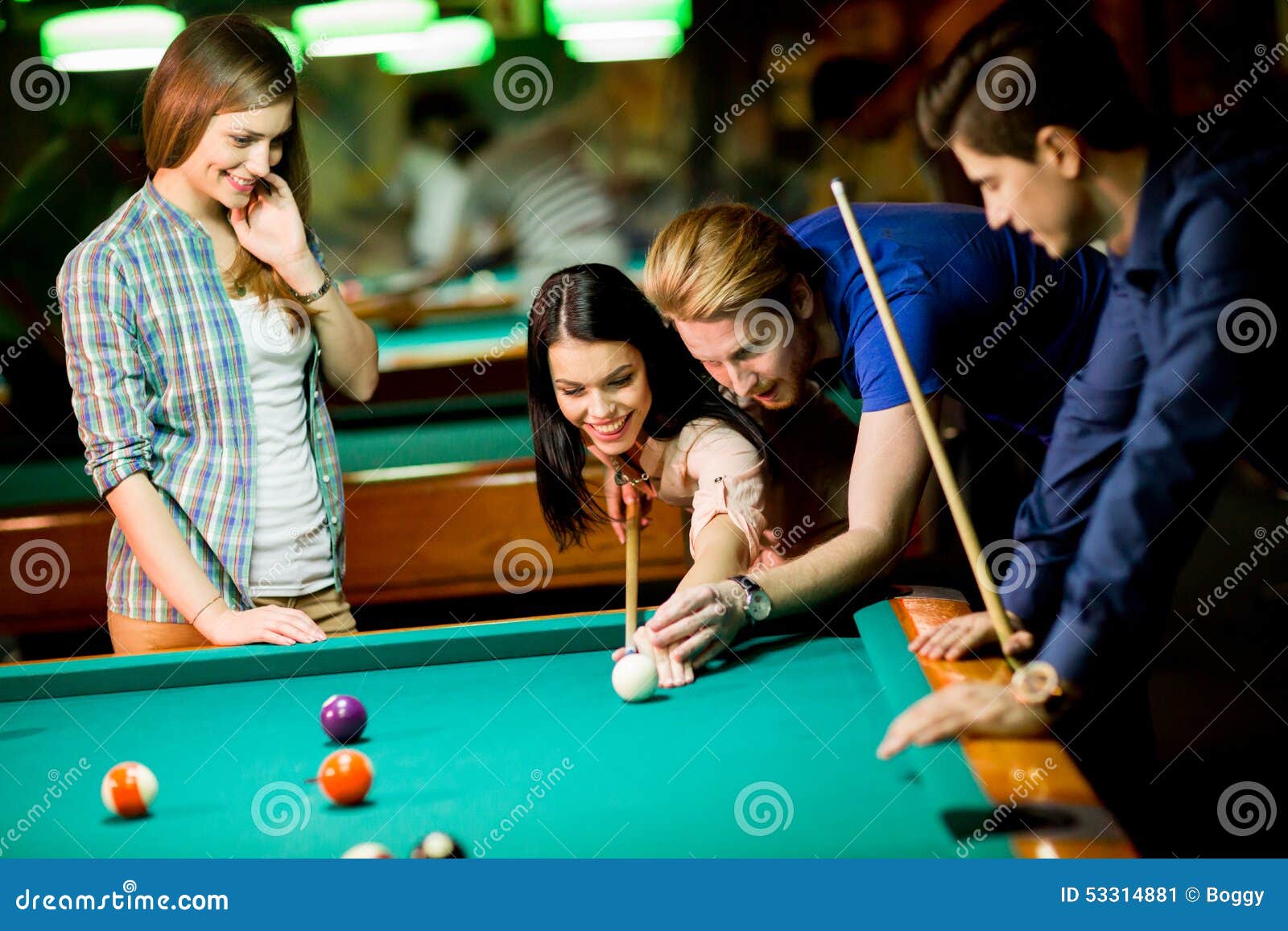 Young people playing pool stock image. Image of playing - 53314881