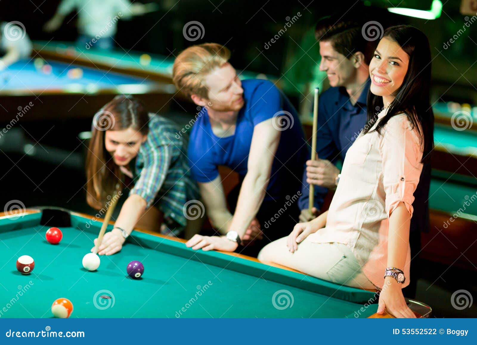 Young people playing pool stock photo. Image of billiard - 53552522