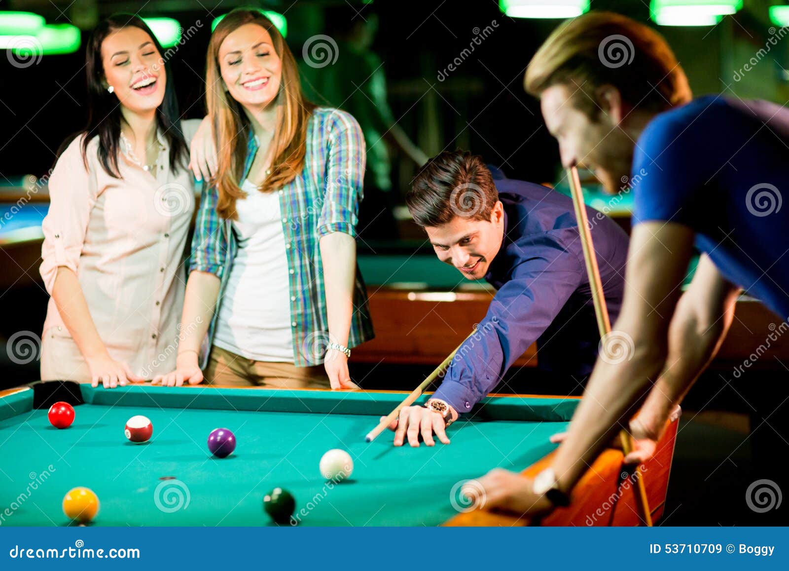 Young people playing pool stock image. Image of relaxation - 53710709