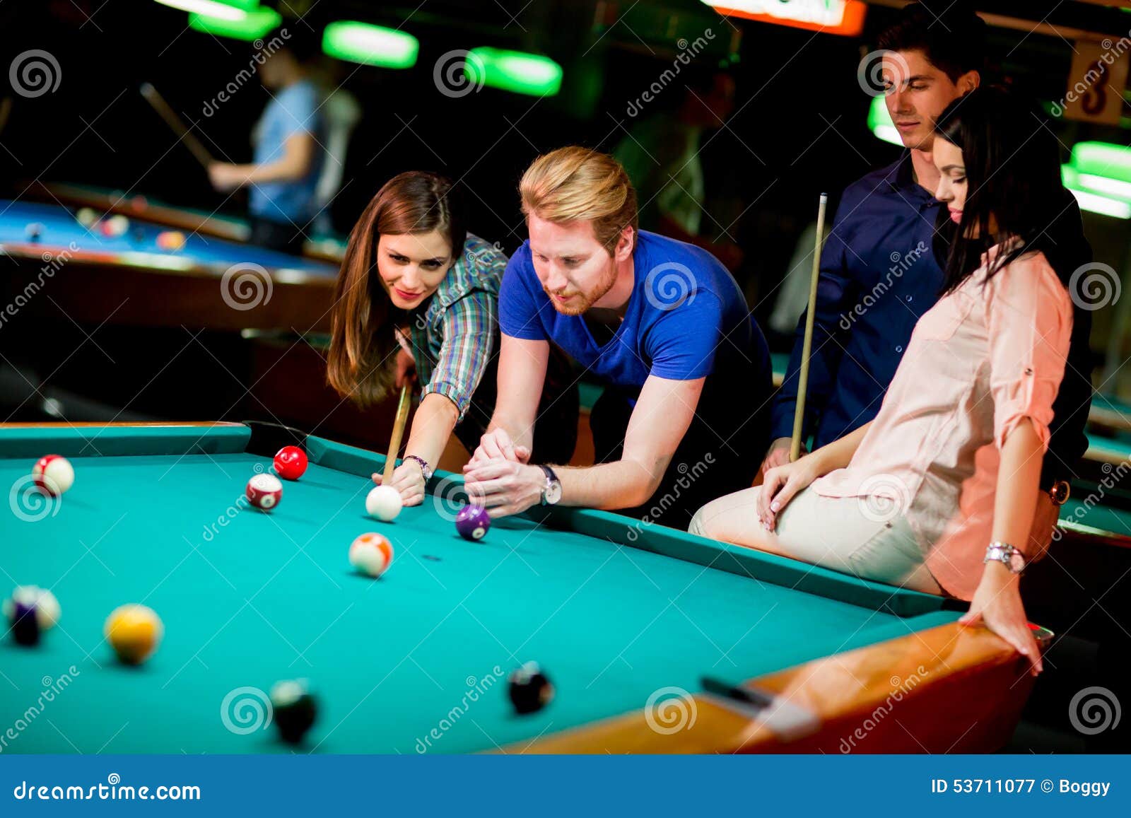 Young people playing pool stock image. Image of looking - 53711077