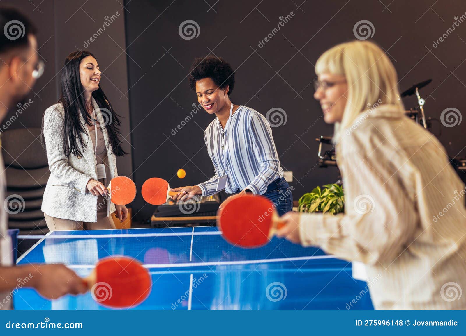People Playing Table Tennis in the Office at Work Stock Photo - Image ...
