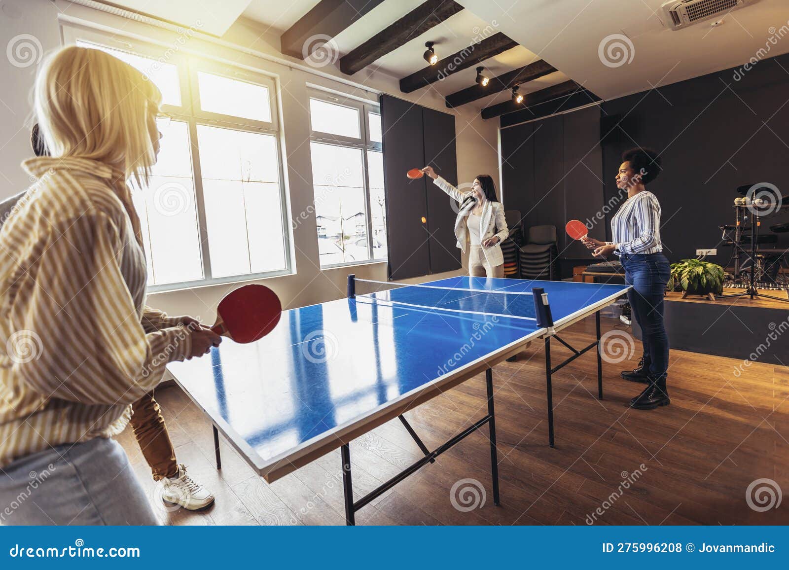 People Playing Table Tennis in the Office at Work Stock Photo - Image ...