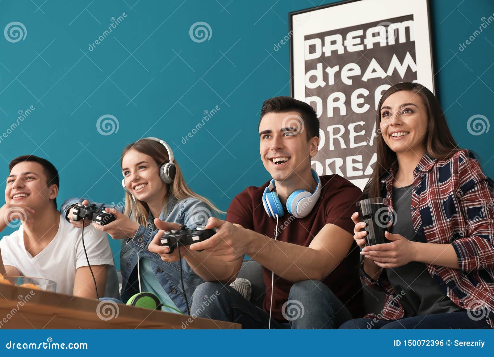 Young People Playing Video Games at Home Stock Photo - Image of gamepad ...