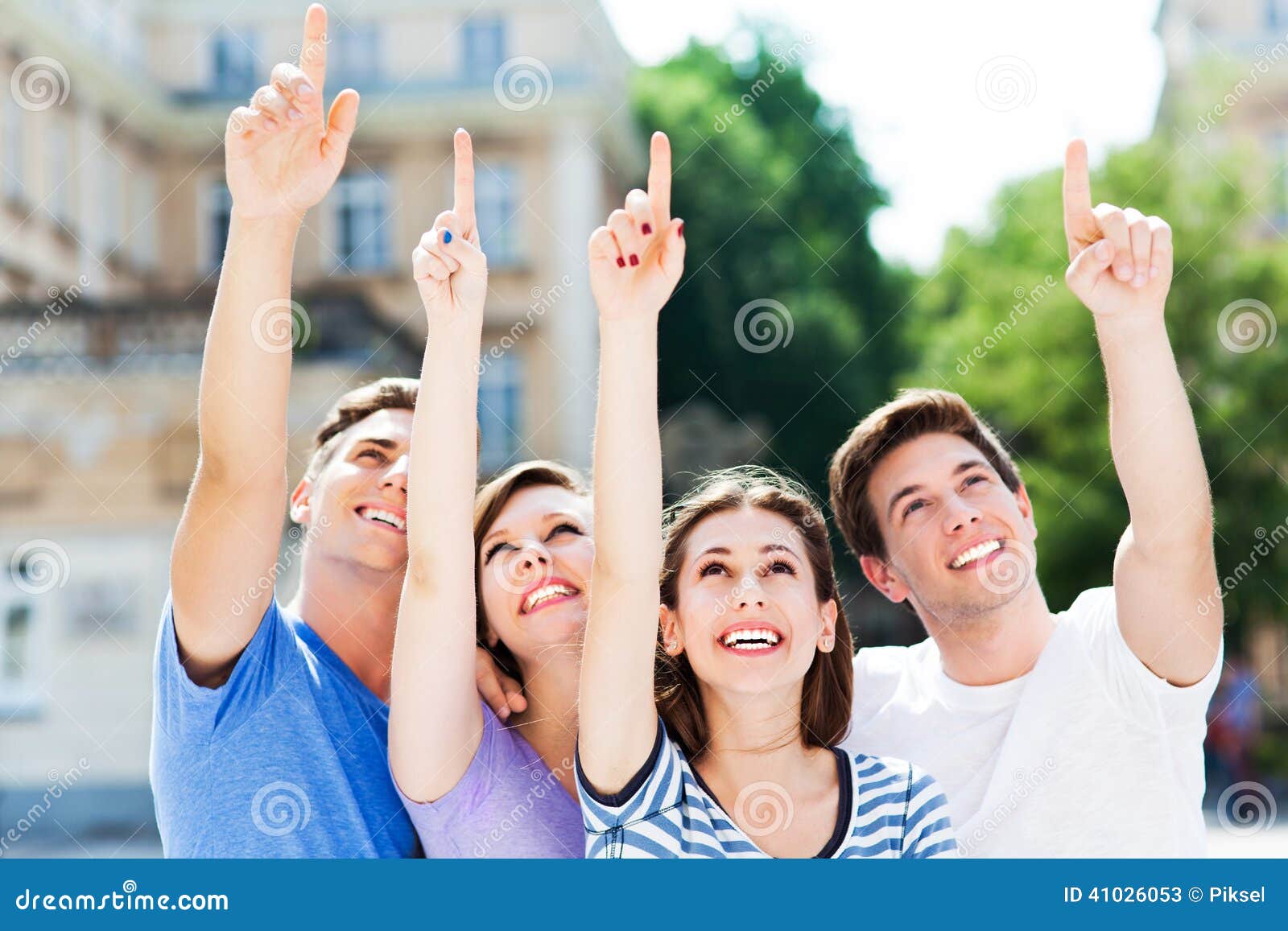 Young people pointing up stock image. Image of hanging - 41026053