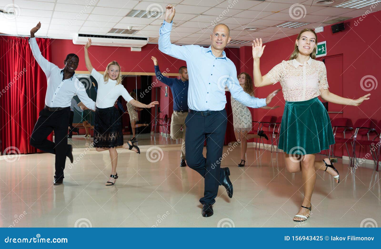 Young People Practicing Twist Movements Together at Modern Dance Studio ...