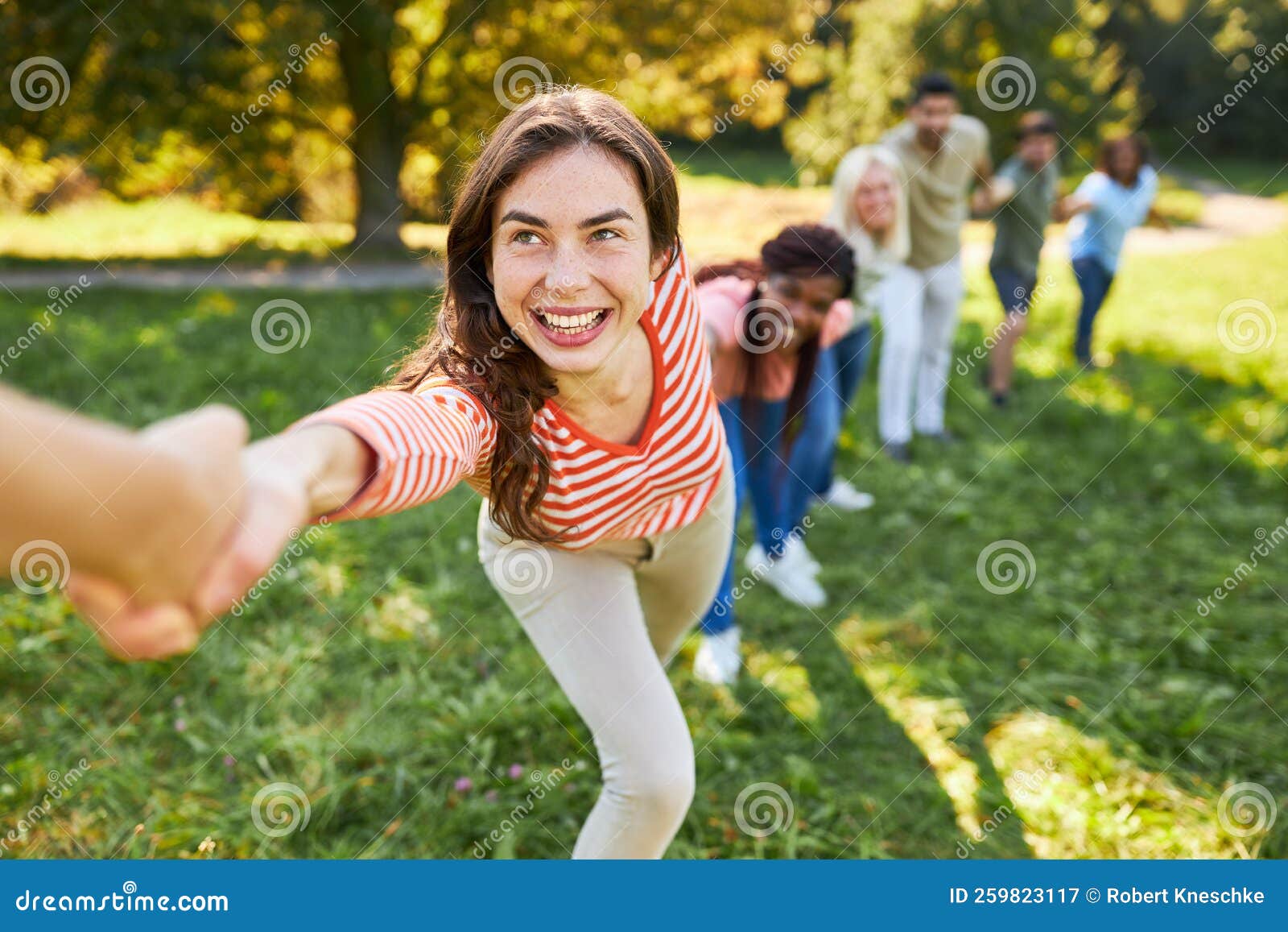 Young People Pulling Hands in a Competition Stock Image - Image of ...