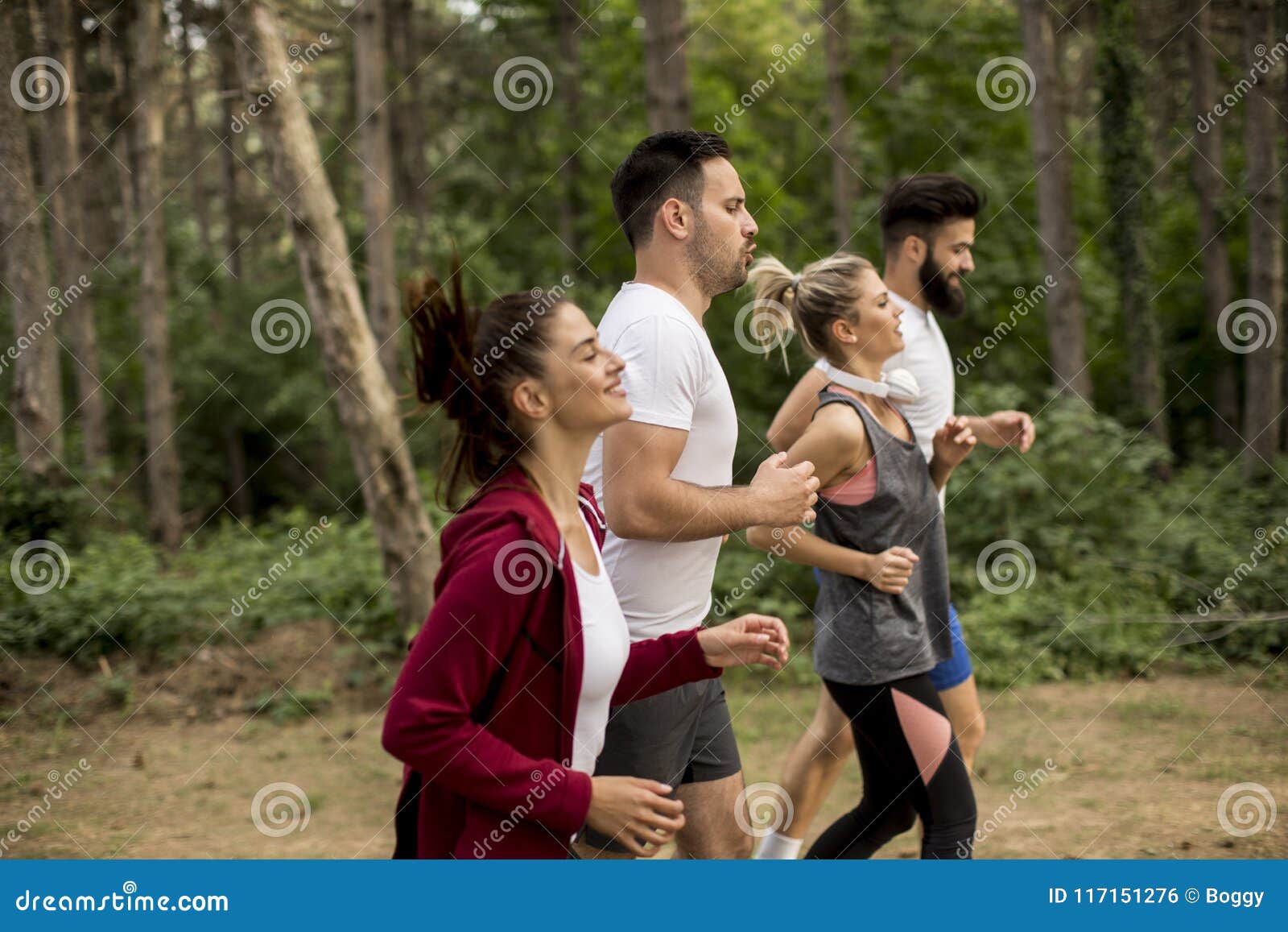 Young People Run a Marathon through the Forest Stock Photo - Image of ...