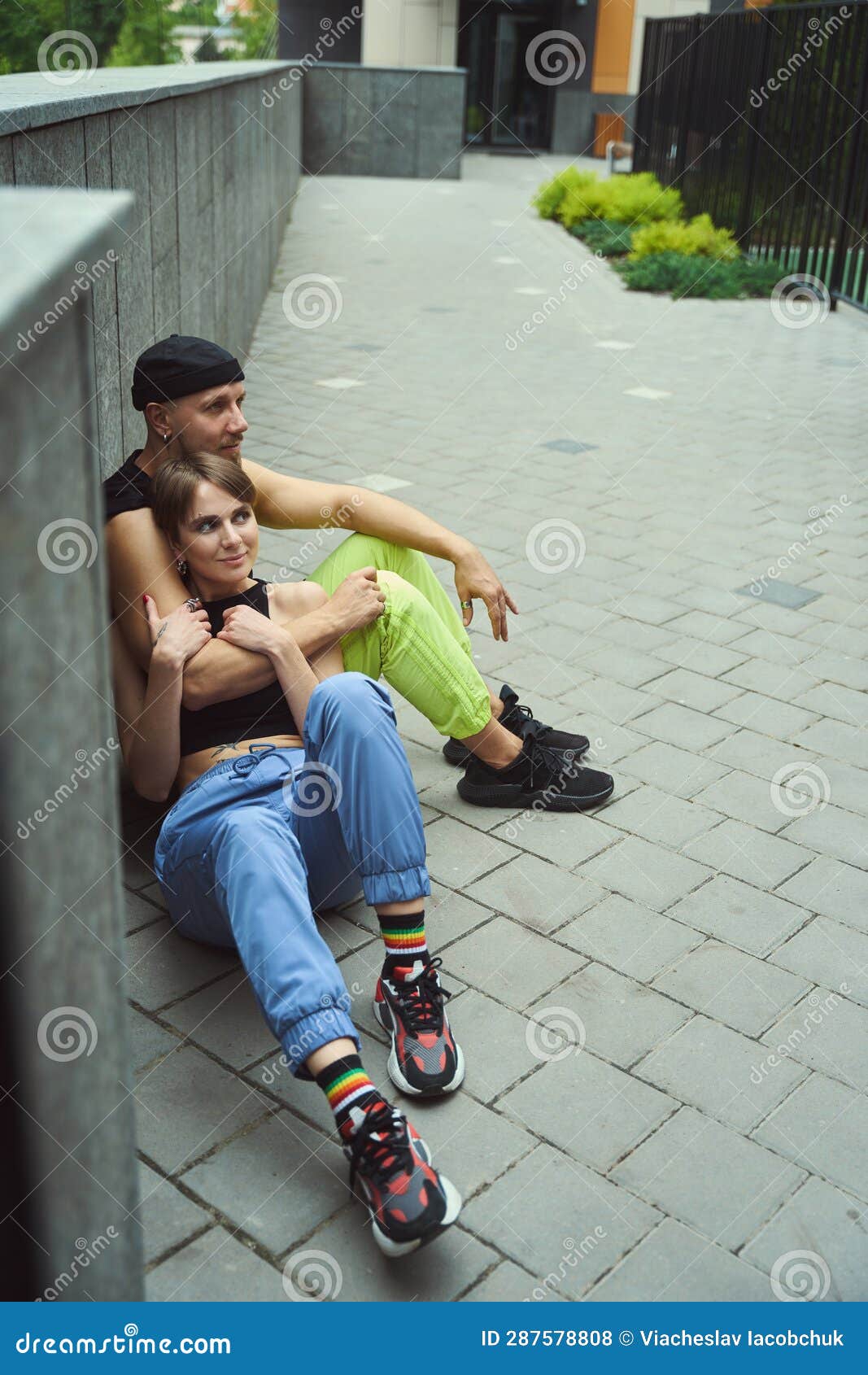 Young People Sit Hugging on the Sidewalk Stock Photo - Image of people ...