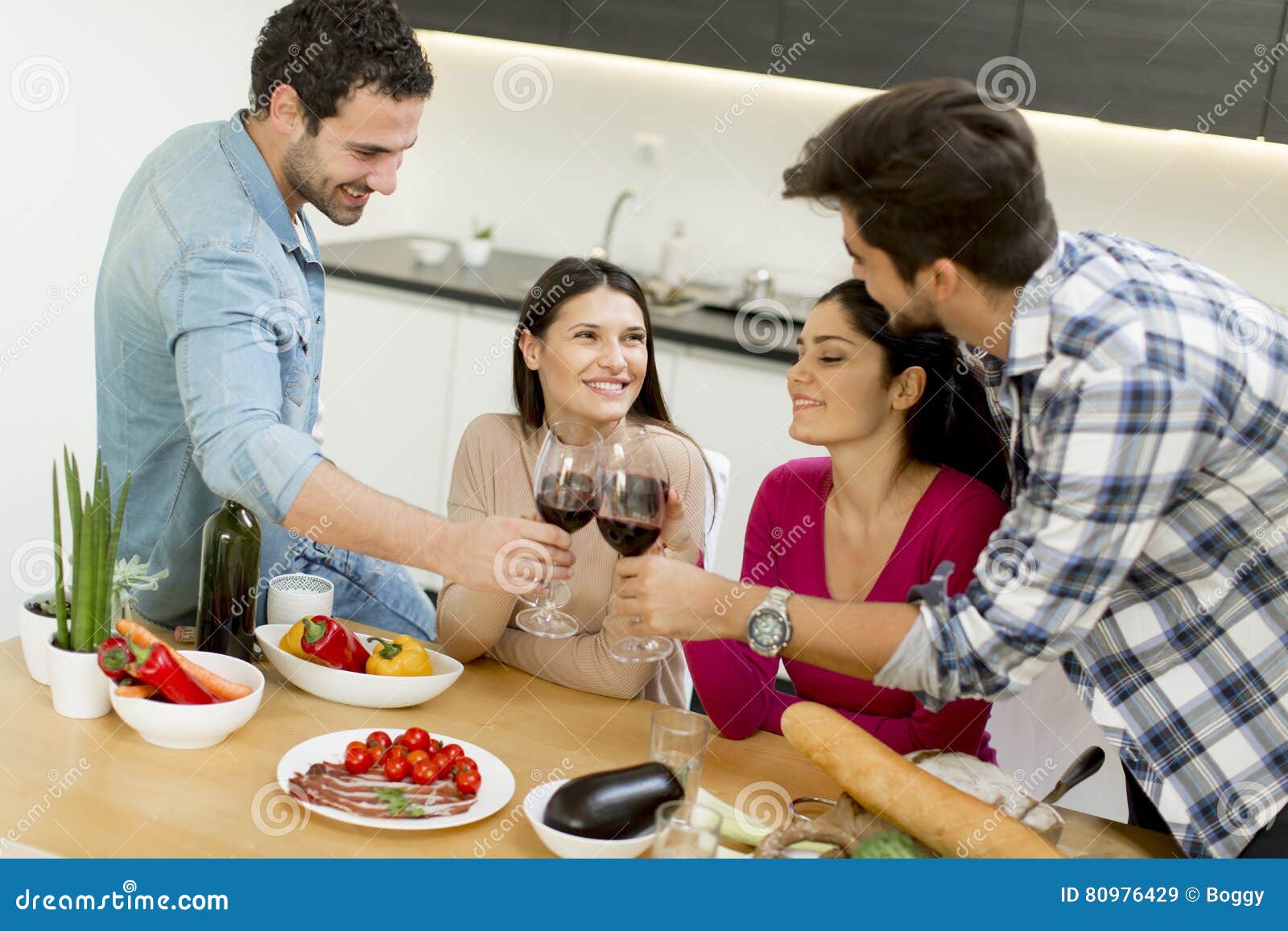 Young People Sitting by the Table Stock Image - Image of celebrating ...