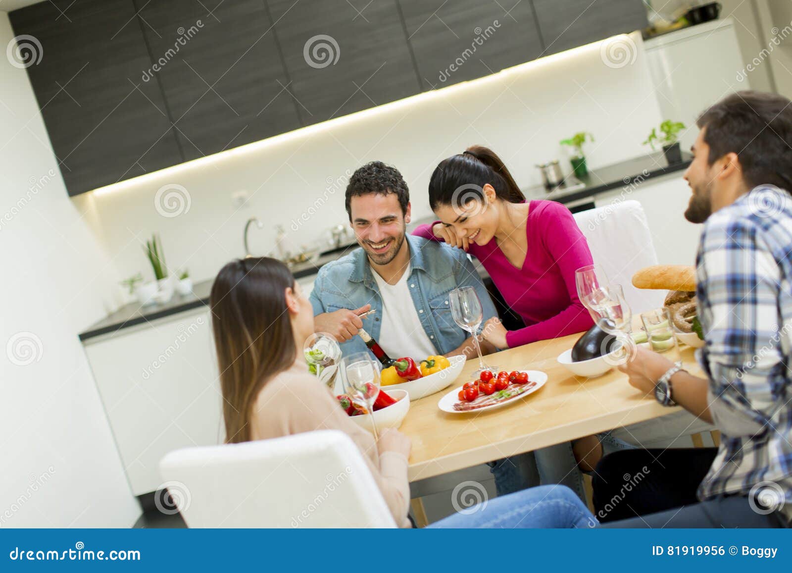 Young People Sitting by the Table Stock Photo - Image of indoors ...