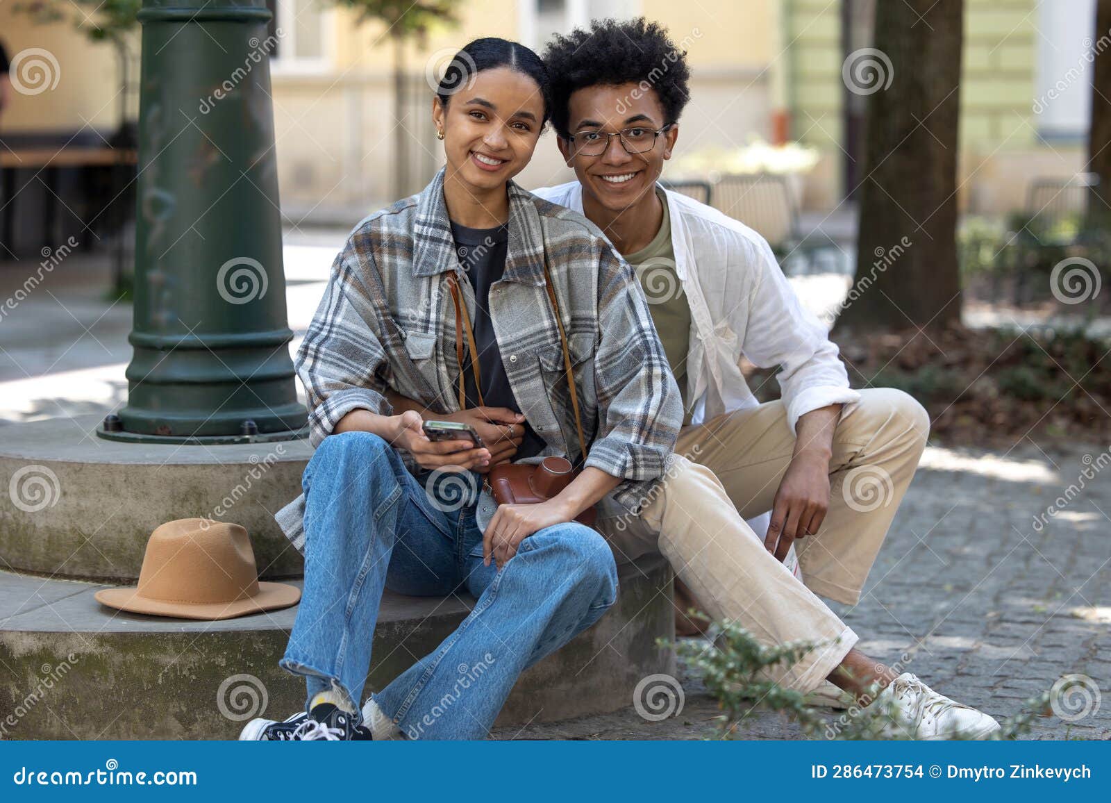 Young People Sitting Together and Looking Happy and Contented Stock ...