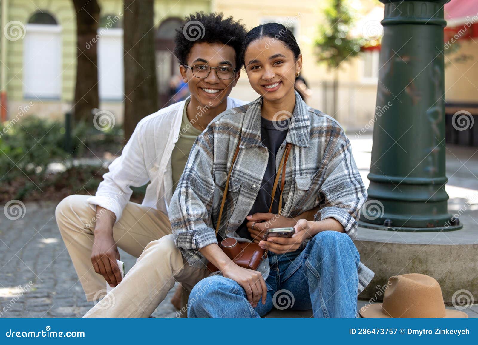 Young People Sitting Together and Looking Happy and Contented Stock ...
