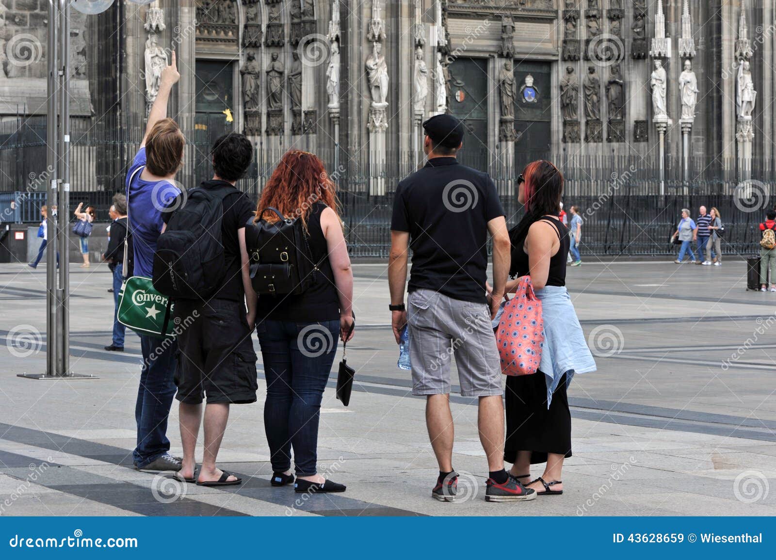 The Young People Stand in Front of the Cologne Cathedral. Editorial ...