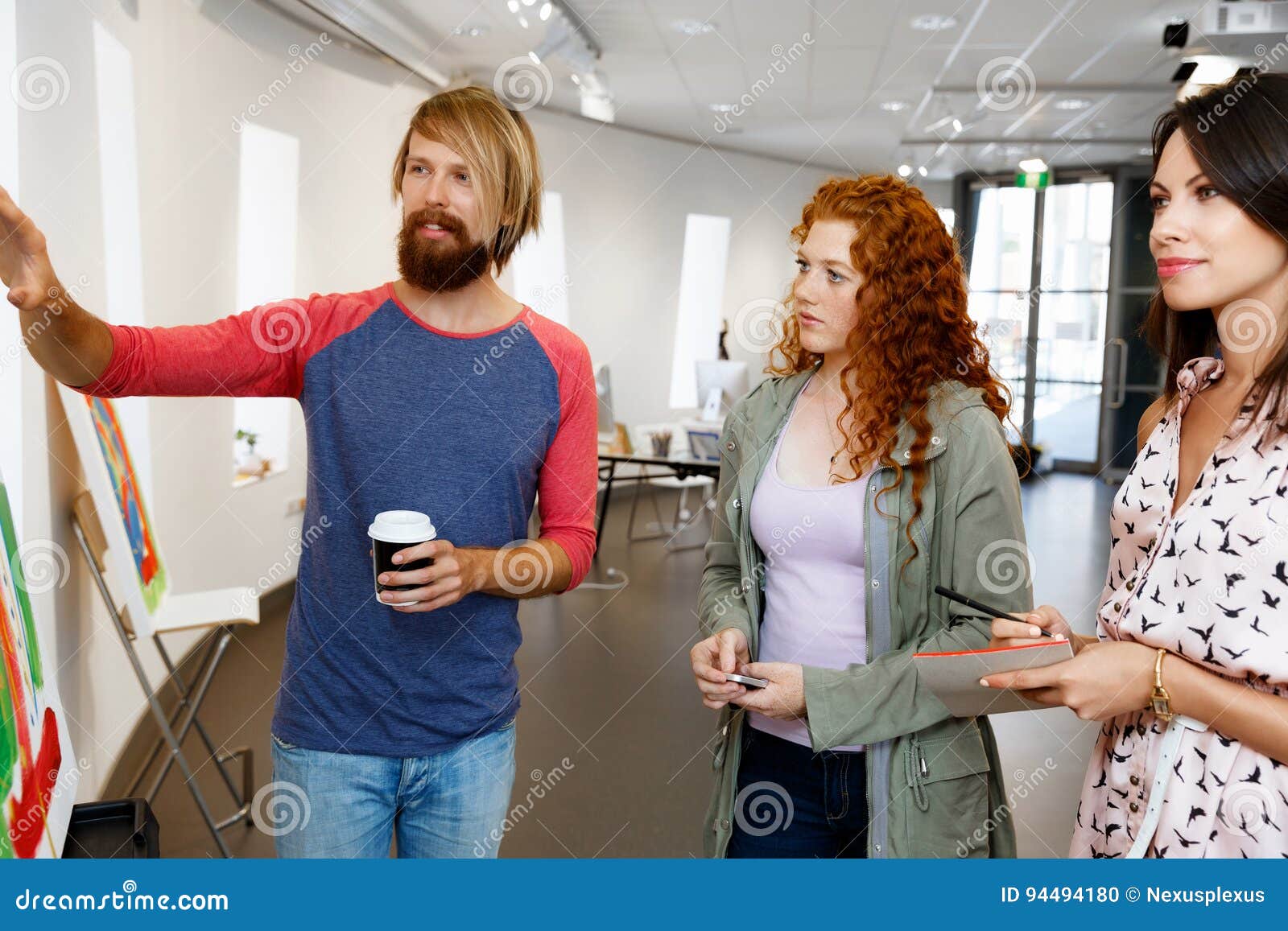 Young People Standing in a Gallery and Contemplating Artwork Stock ...