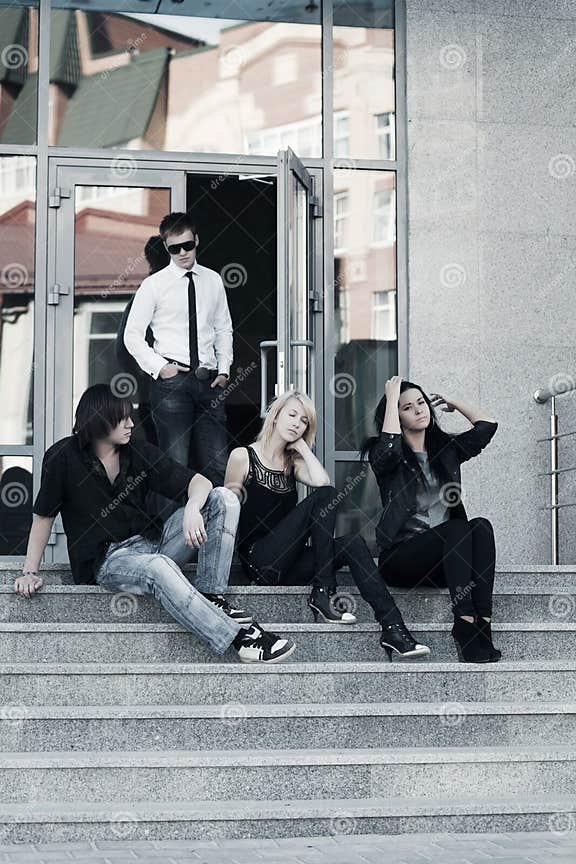 Young people on the steps stock photo. Image of house - 23212476