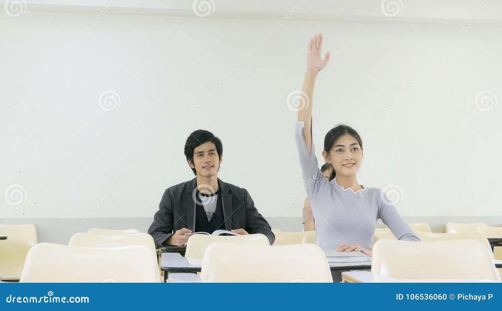 Young People Student Push Hand Up in the Indoor Classroom Stock Photo ...