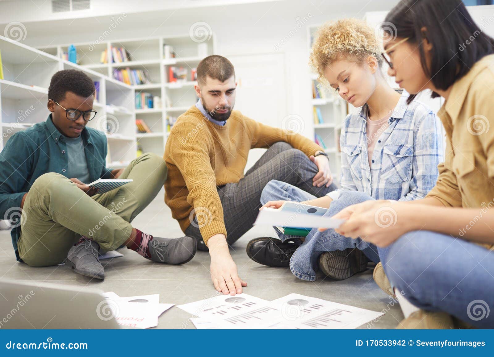Young People Studying on Floor Stock Photo - Image of discussion, adult ...