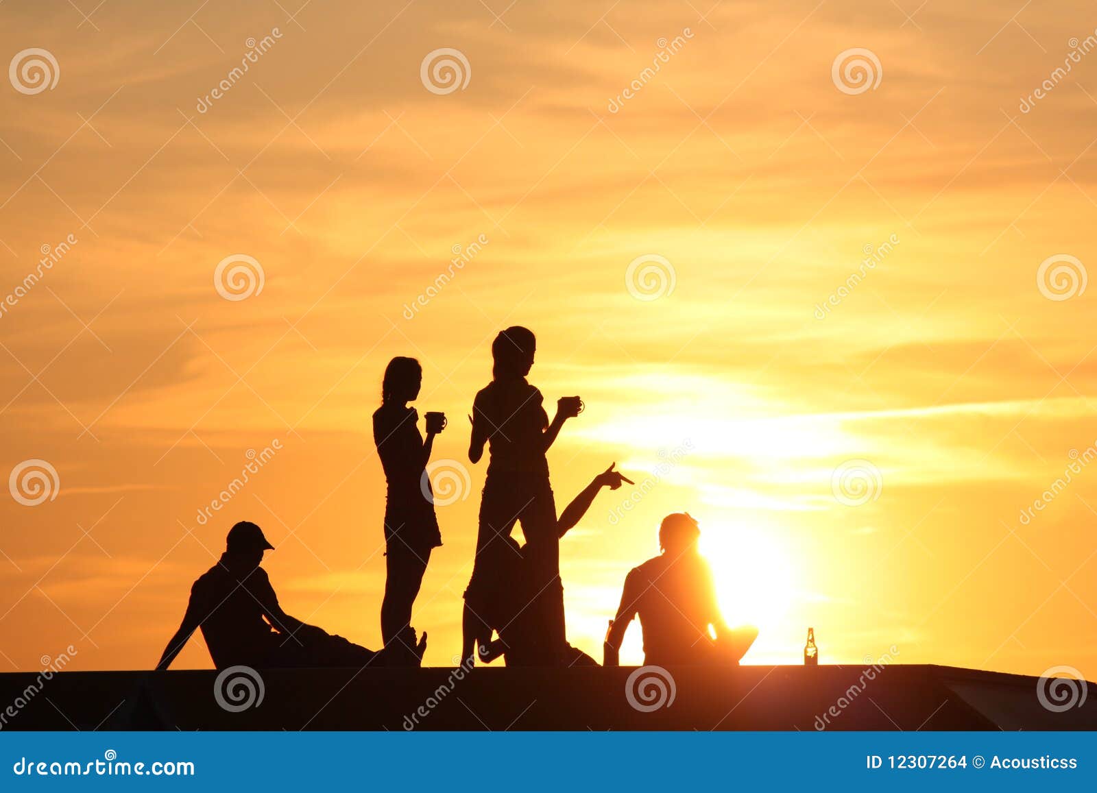 Young people at sunset stock photo. Image of peaceful - 12307264