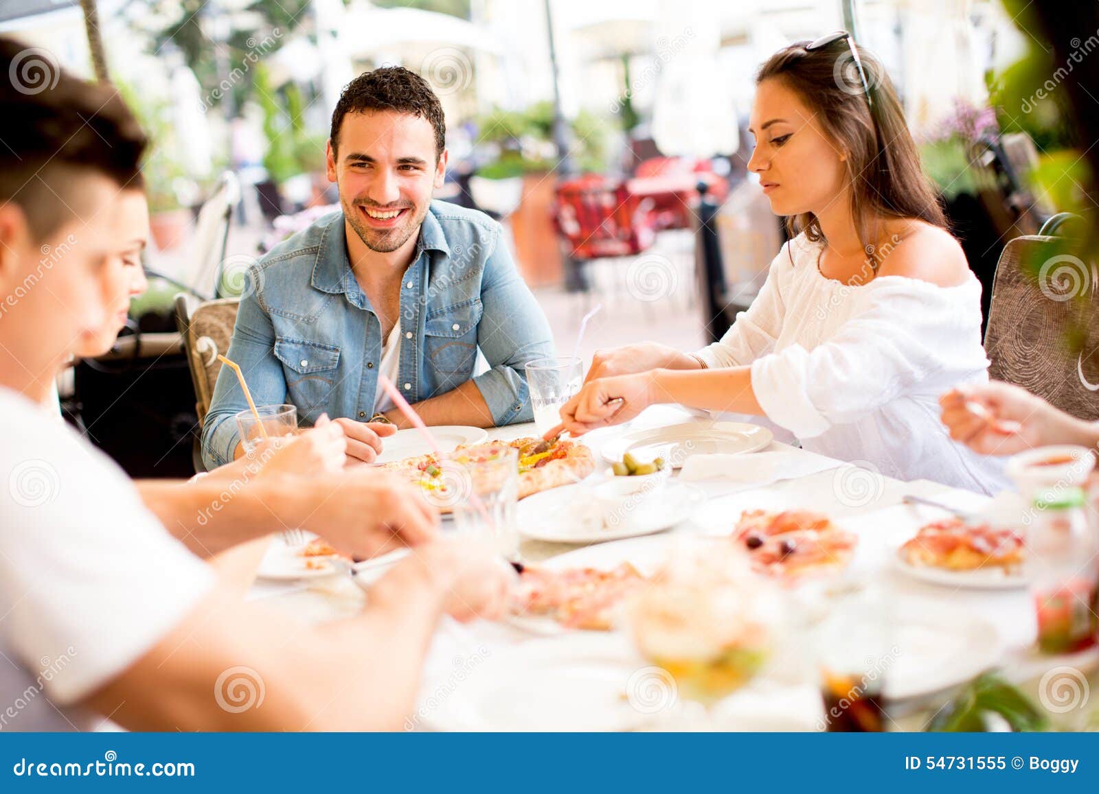 Young people by the table stock image. Image of relaxation - 54731555