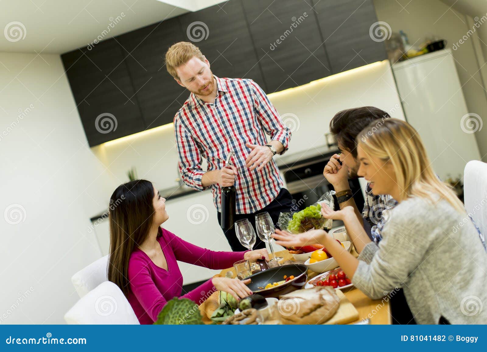 Young People at the Table in Kitchen Stock Photo - Image of meal ...