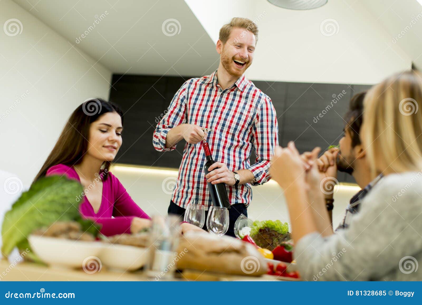 Young People at the Table in Kitchen Stock Image - Image of people ...