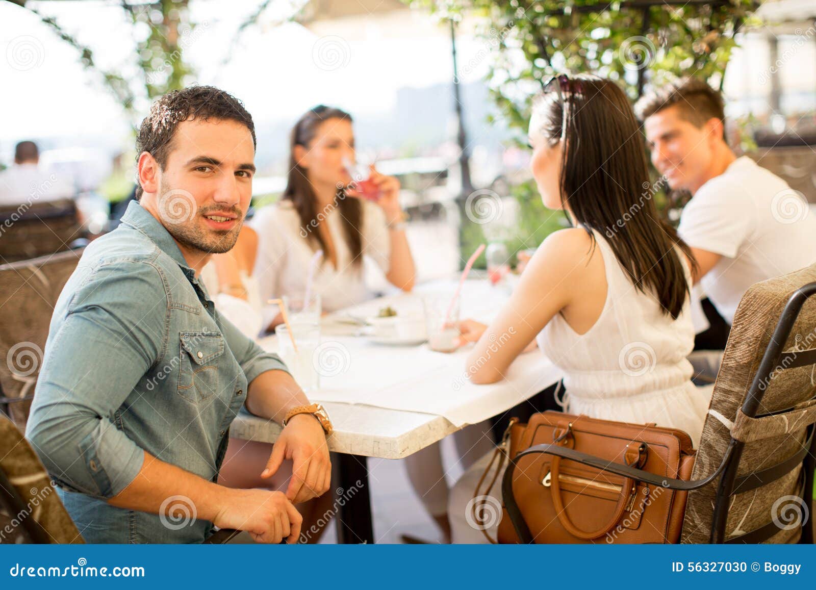 Young people by the table stock photo. Image of young - 56327030