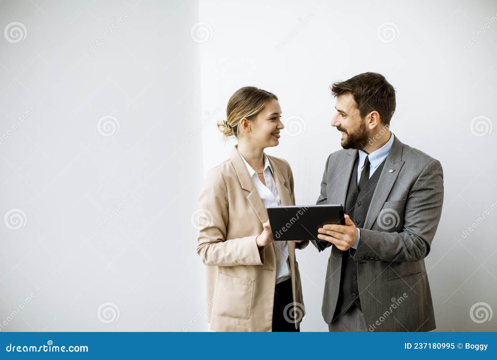 Young People with Tablet by the Wall in the Office Stock Image - Image ...
