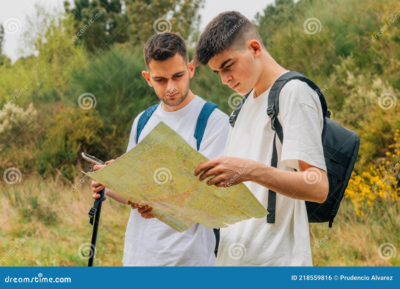 People on a Trip Looking at the Map Stock Photo - Image of path ...