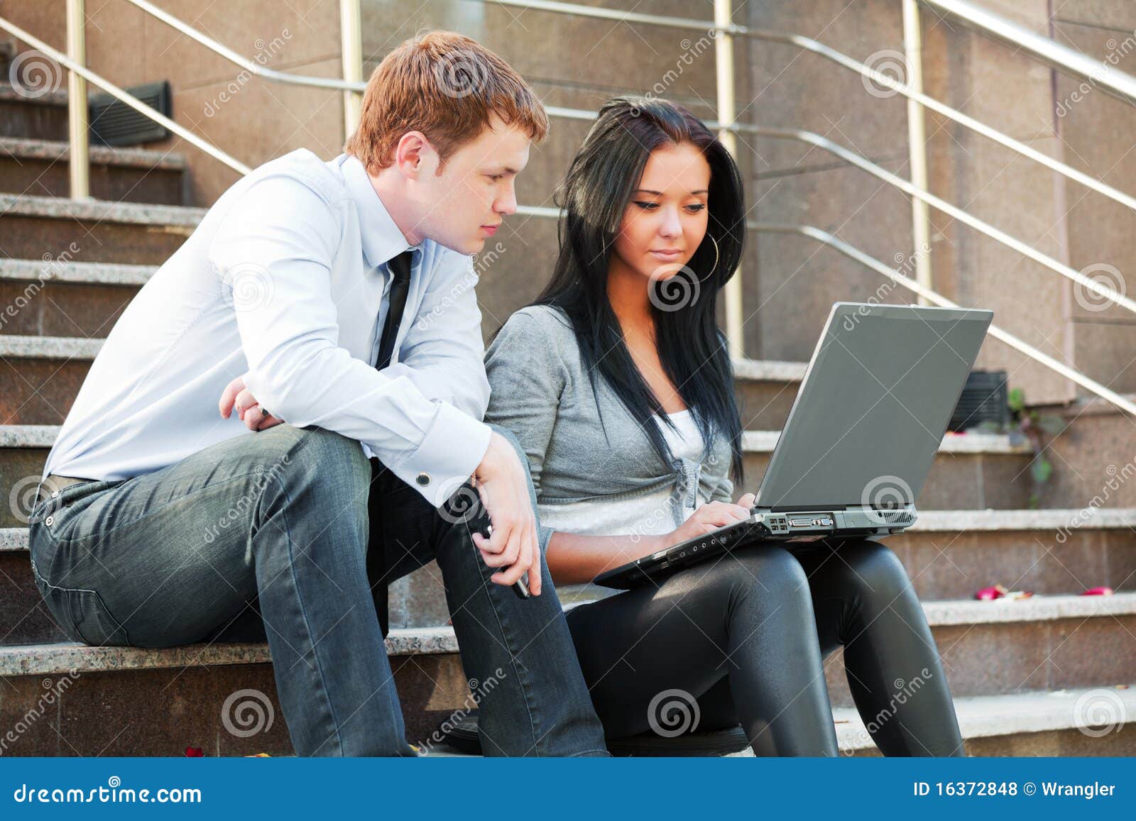 Young Business People Using Laptop on the Steps Stock Photo - Image of ...