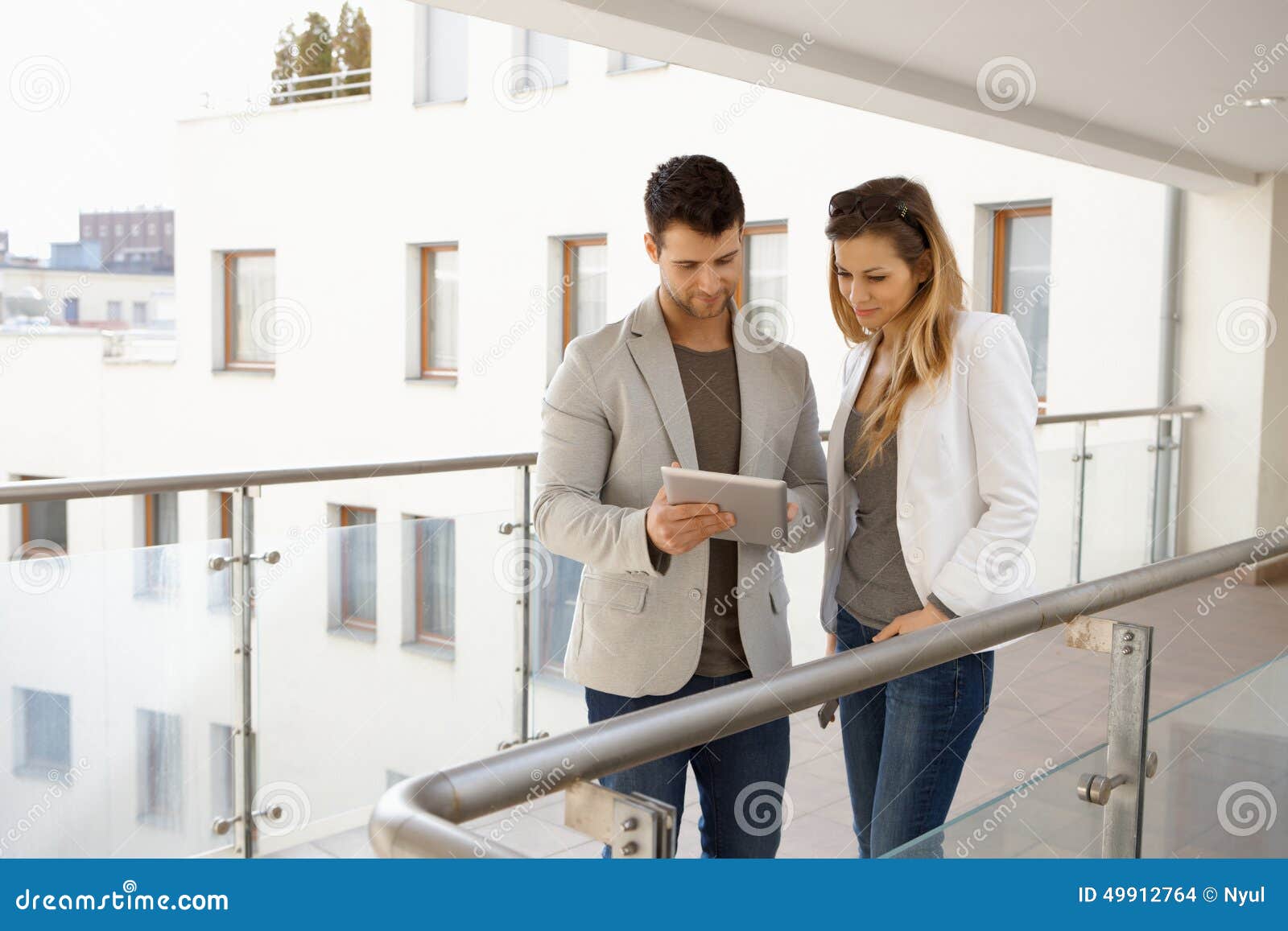 Young people using tablet stock photo. Image of agent - 49912764