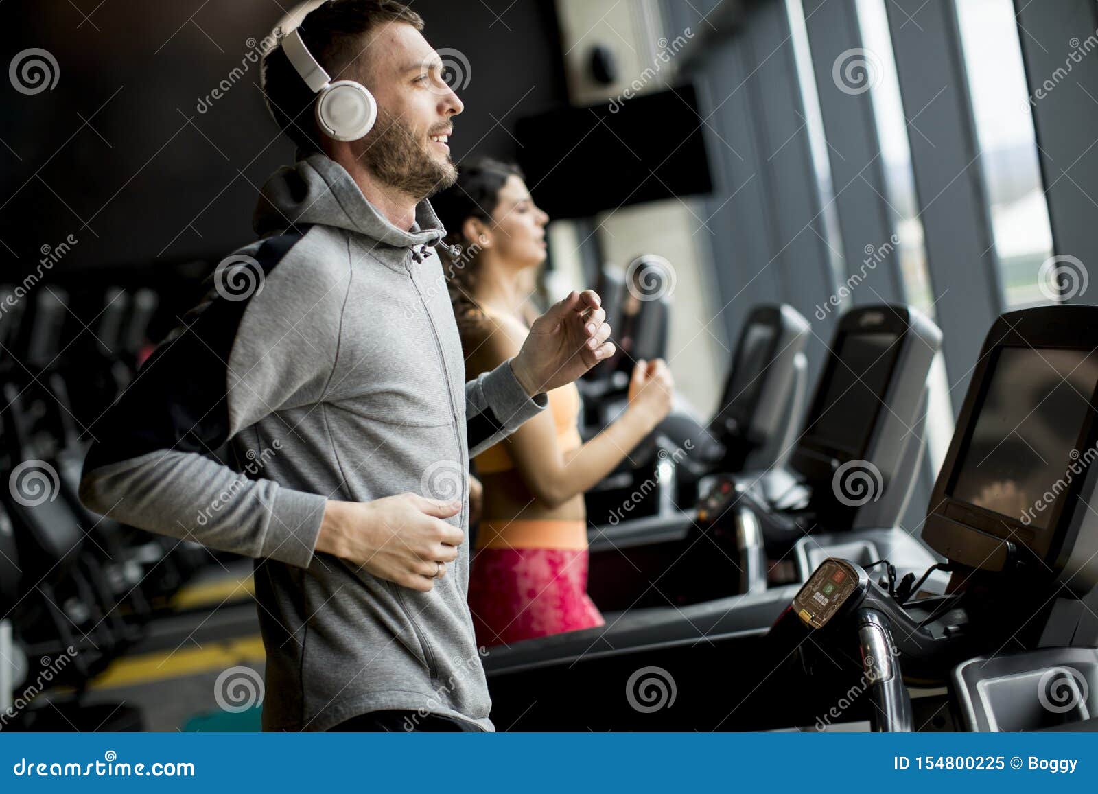 Young People Using Threadmill in Modern Gym Stock Image - Image of ...