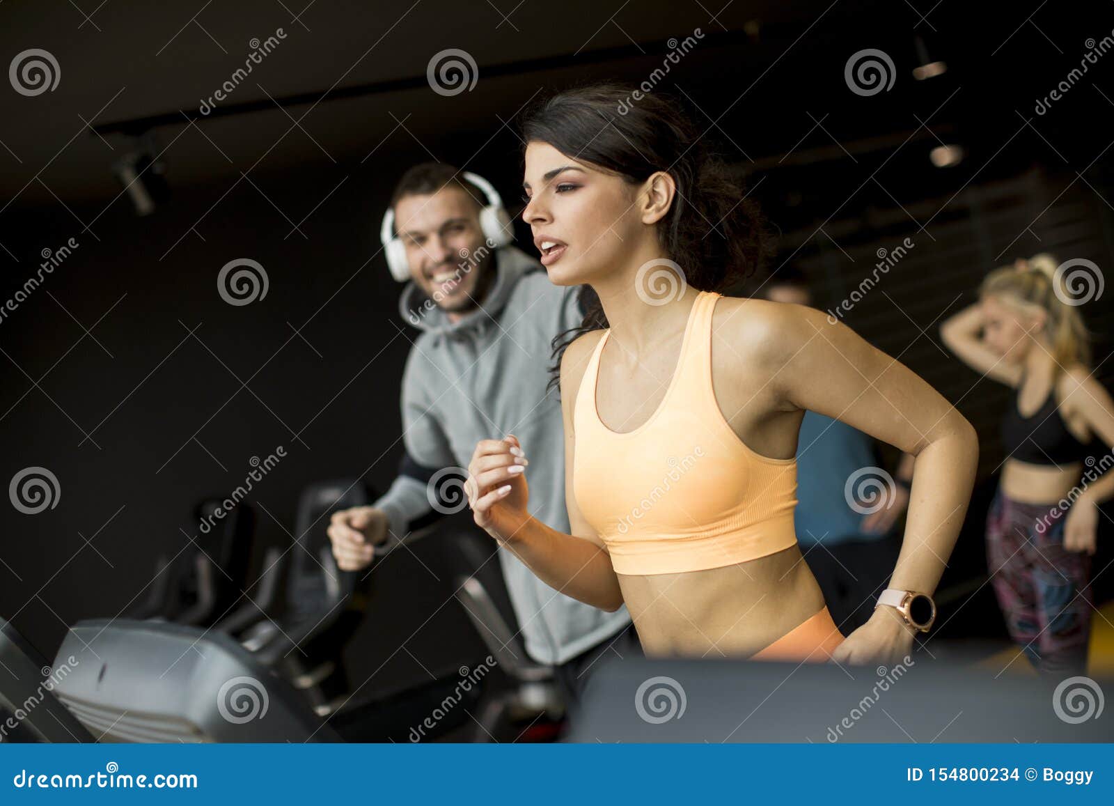Young People Using Threadmill in Modern Gym Stock Photo - Image of ...