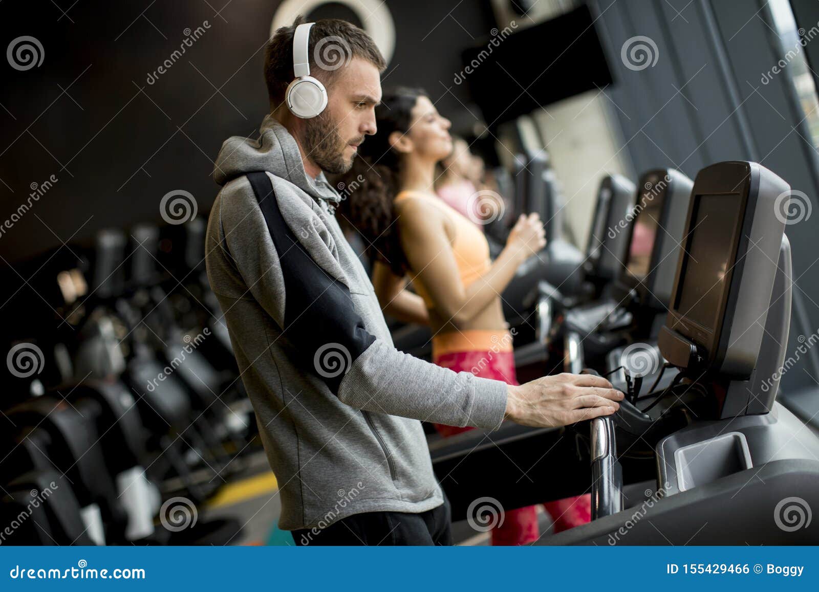 Young People Using Threadmill in Modern Gym Stock Photo - Image of ...