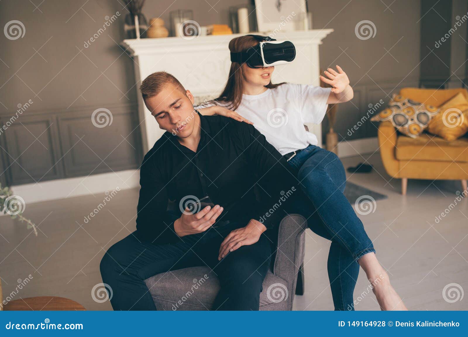 Young Man and Woman Using VR in the Living Room Stock Photo - Image of ...
